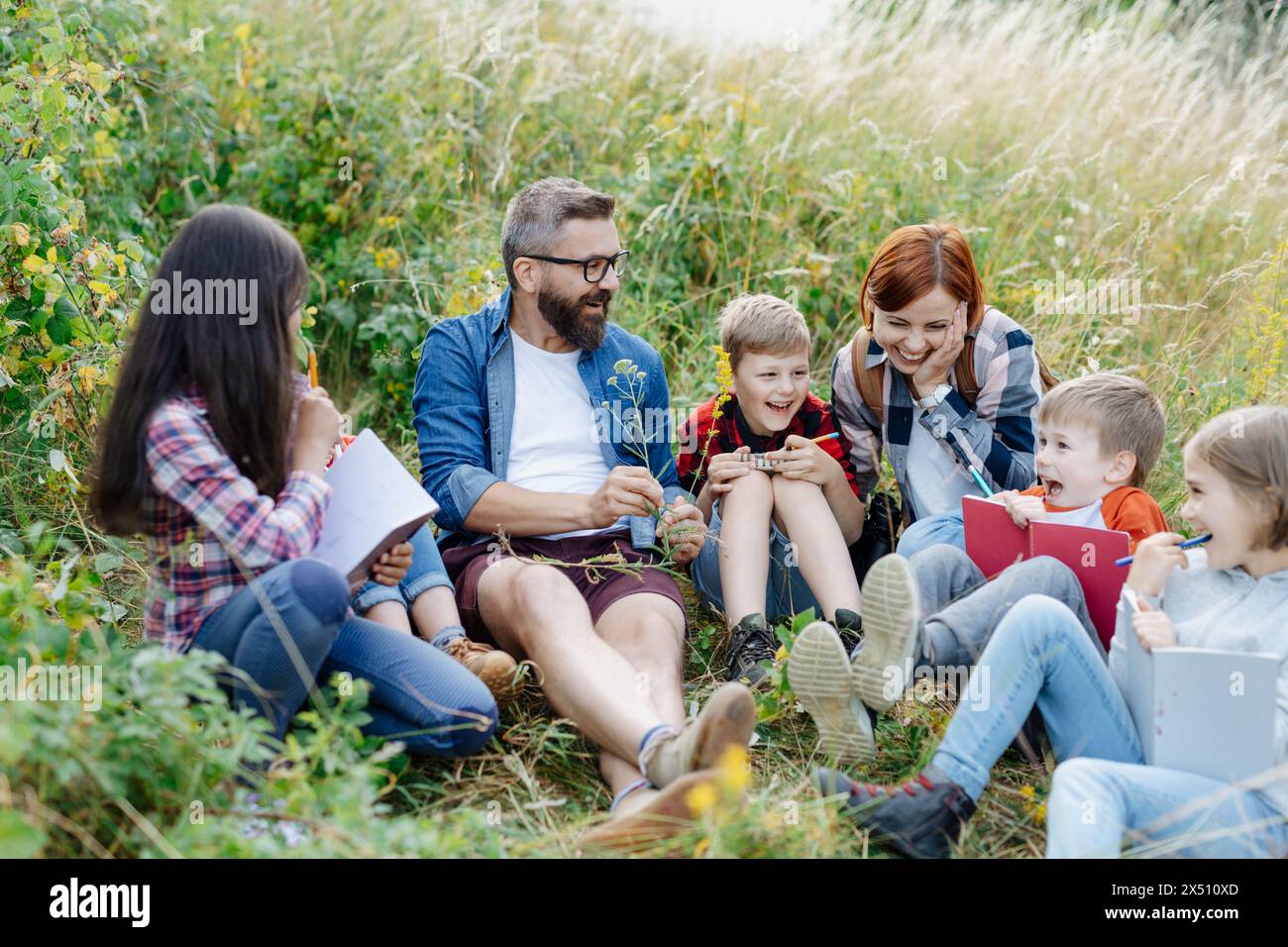 Young students learning about nature, forest ecosystem during biology ...