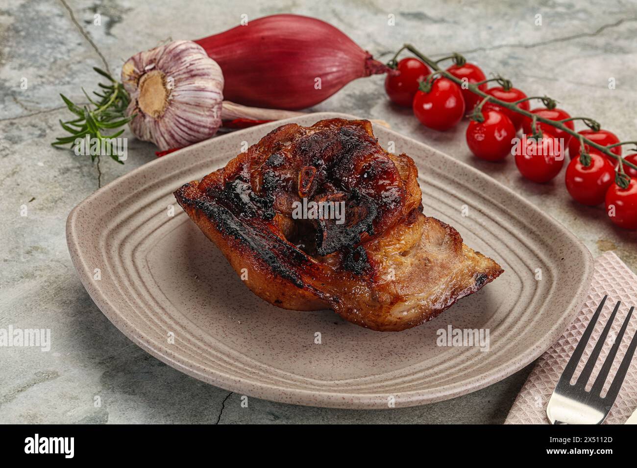 Roasted pork knuckle steak with bone Stock Photo - Alamy