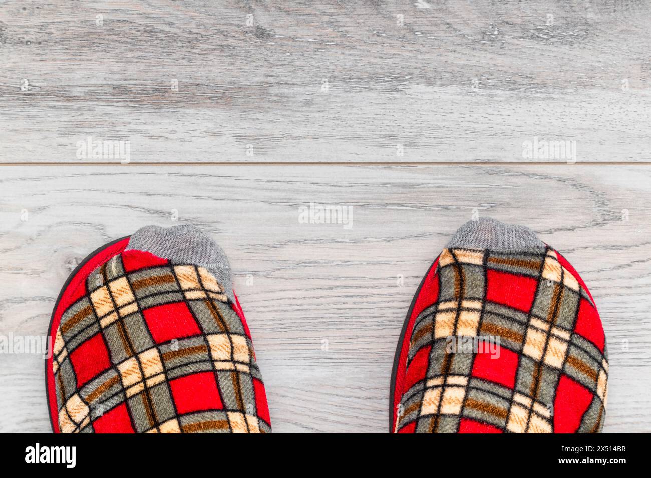 foot shod in an old leaky slipper. holey sneaker. the toe sticks out of ...