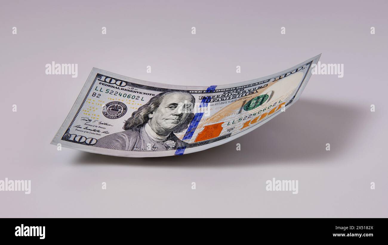 Single $100 Bill on Plain Background for Financial Concepts Stock Photo ...