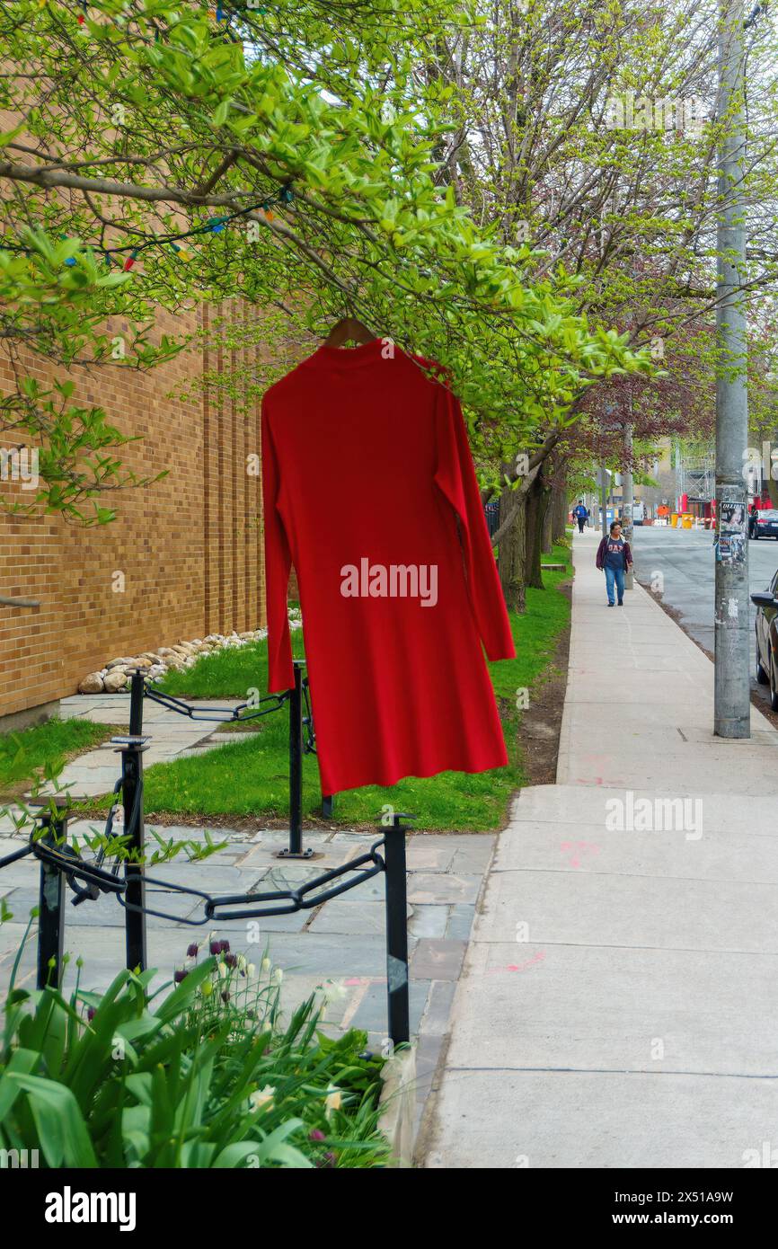 Red dress protest symbol by sidewalk in Toronto, Canada Stock Photo - Alamy