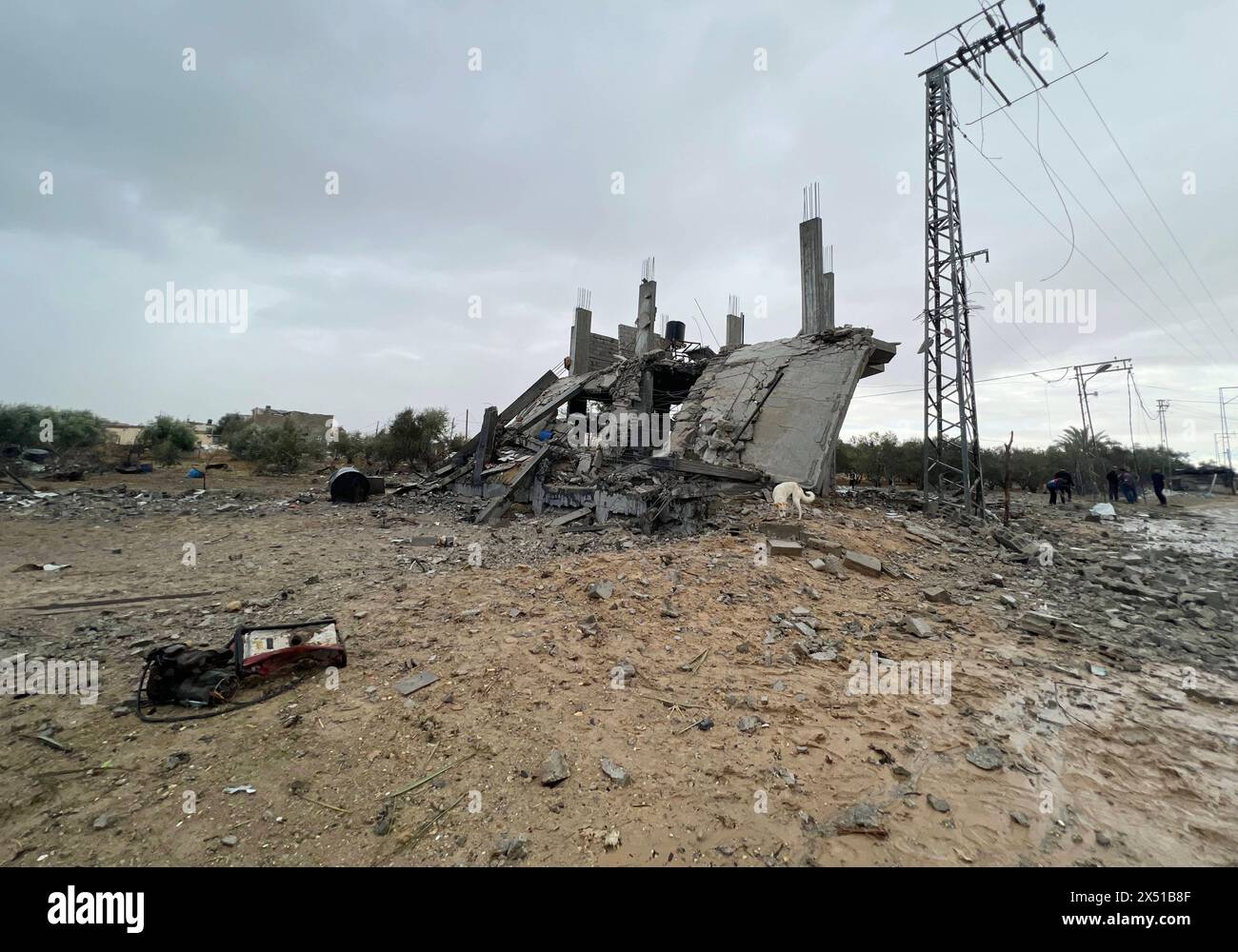 Palestinians inspect a damaged house after Israeli warplanes bombed ...
