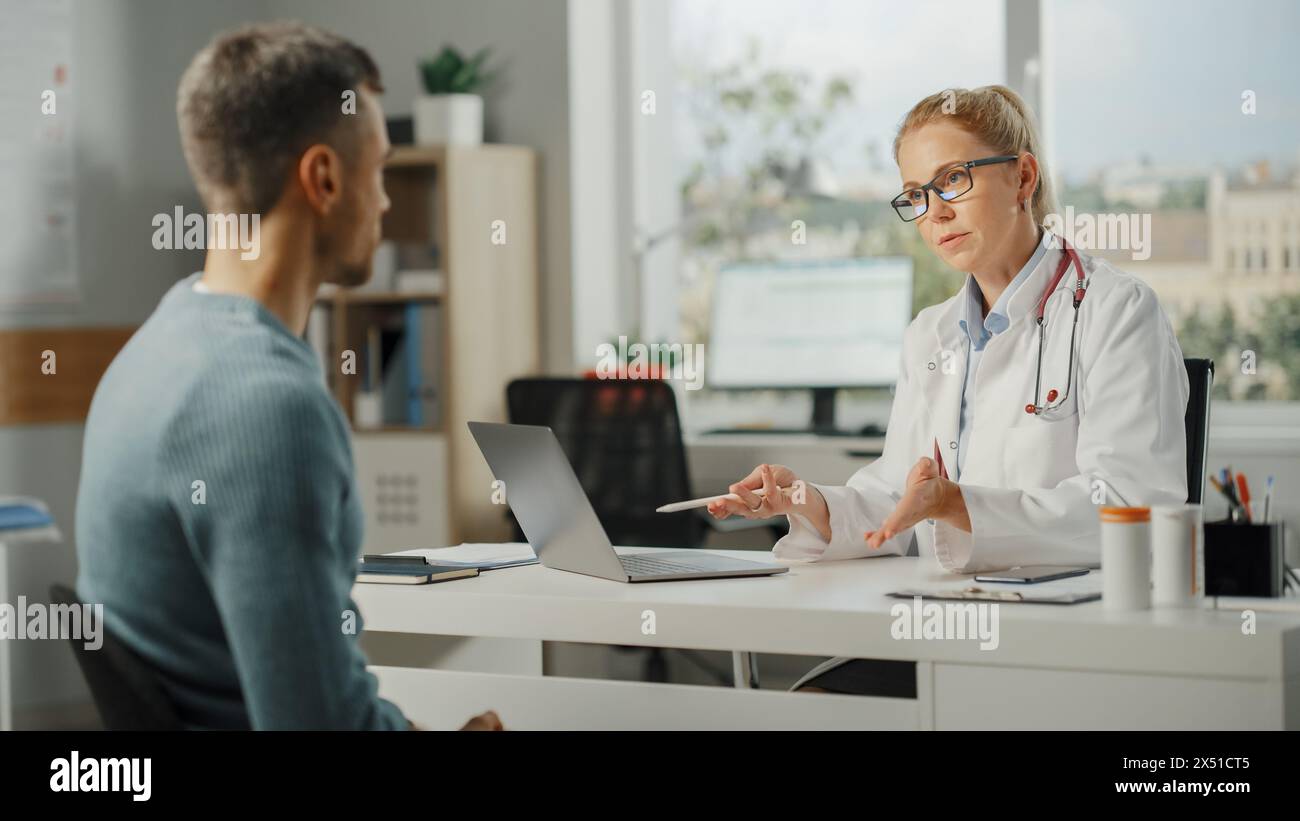 Female Family Doctor is Talking with Healthy Young Male Patient During ...