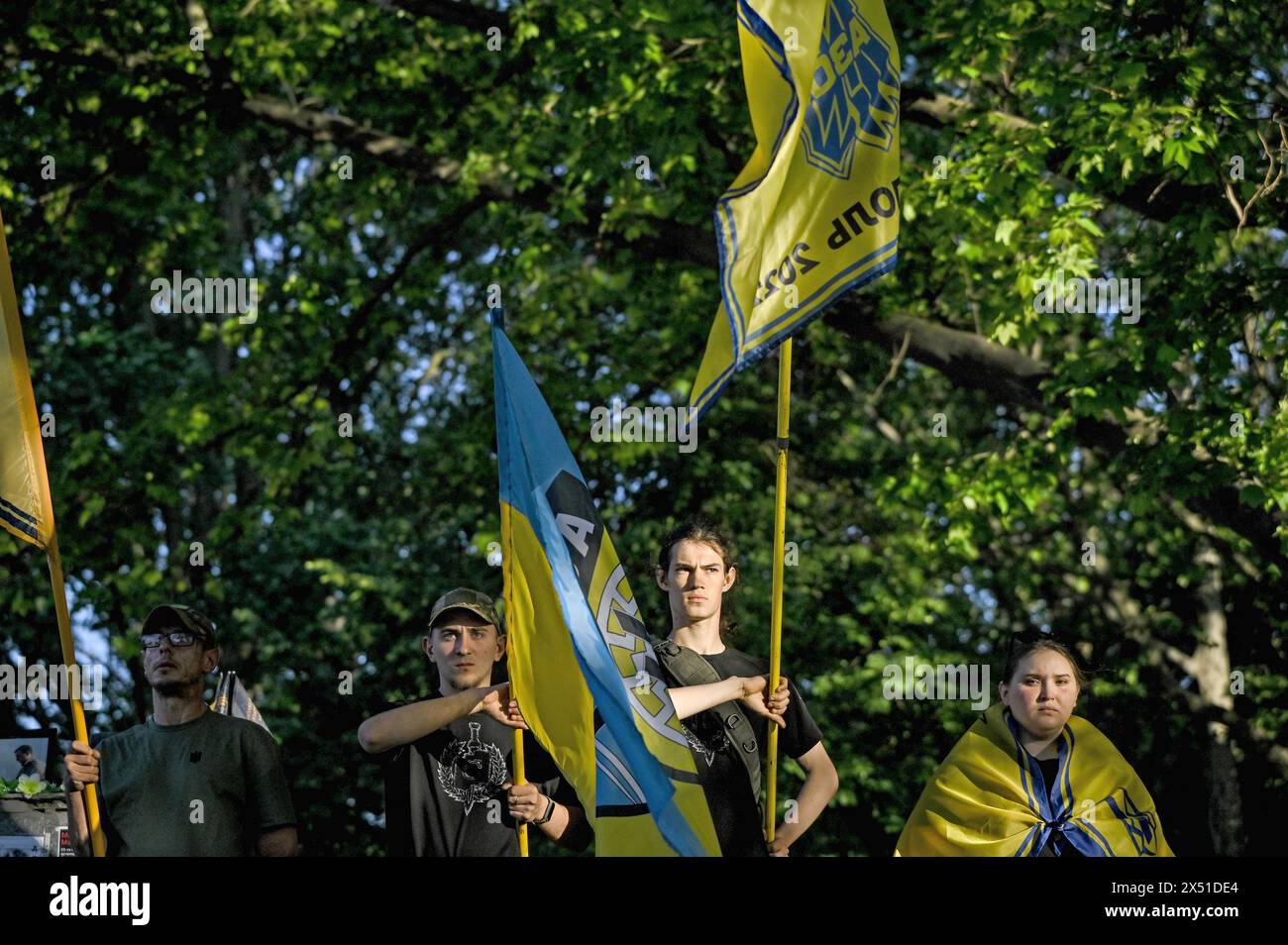 Non Exclusive: ZAPORIZHZHIA, UKRAINE - MAY 5, 2024 - Men hold flags ...