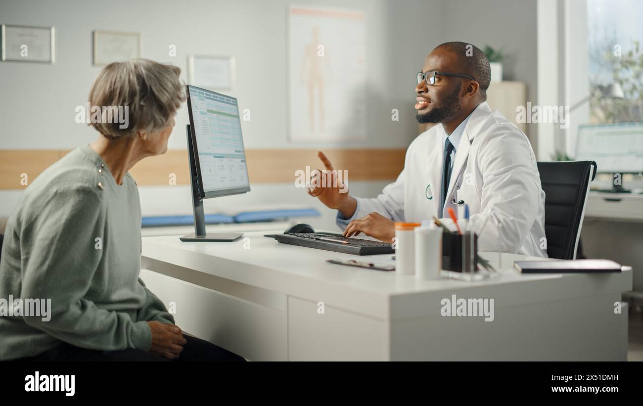 African American Family Doctor is Prescribing Medication to Senior ...