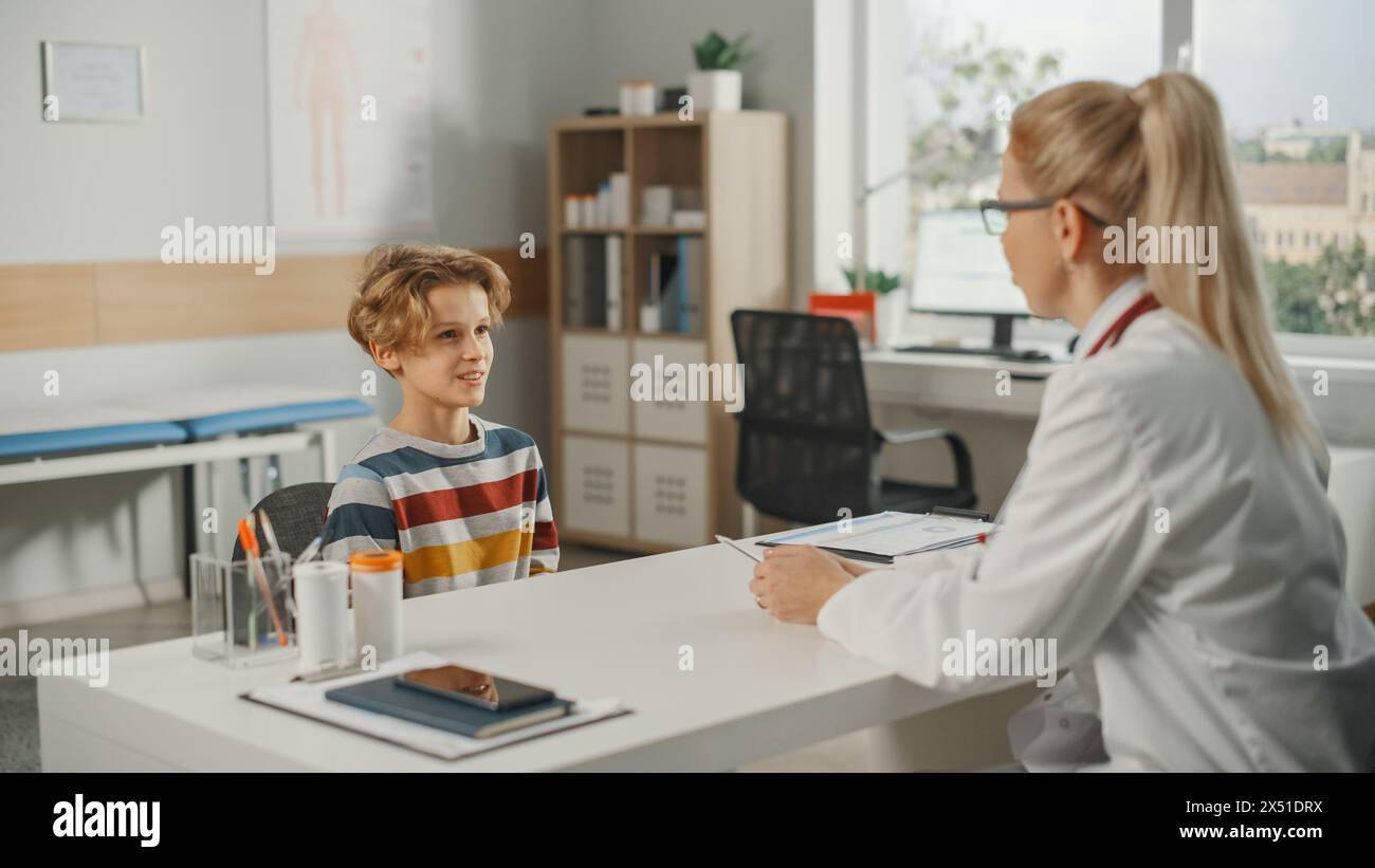 Female Family Doctor Talking with Healthy Young Handsome Teenage Boy ...