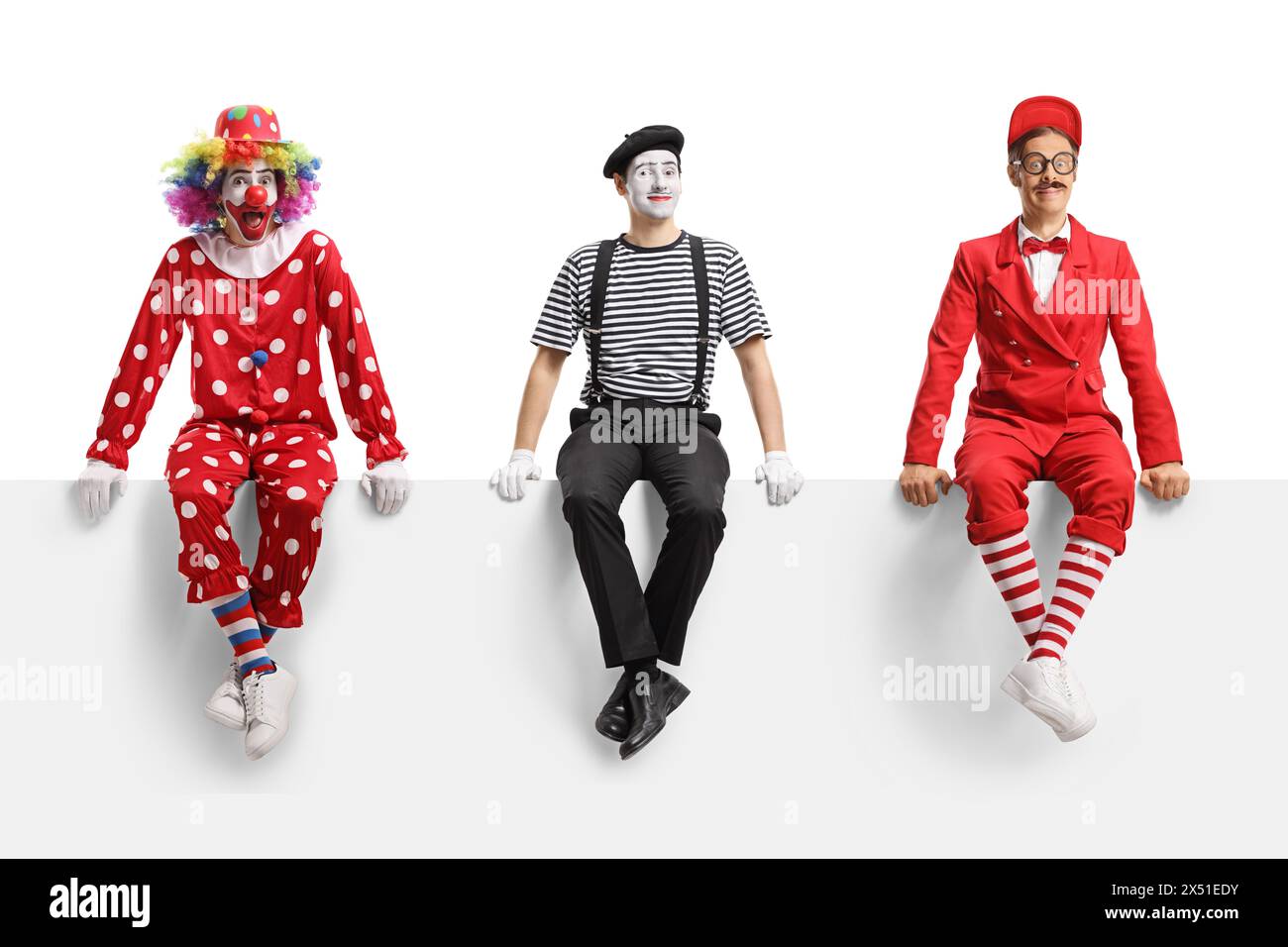 Clown, mime and an entertainer sitting on a blank panel isolated on ...