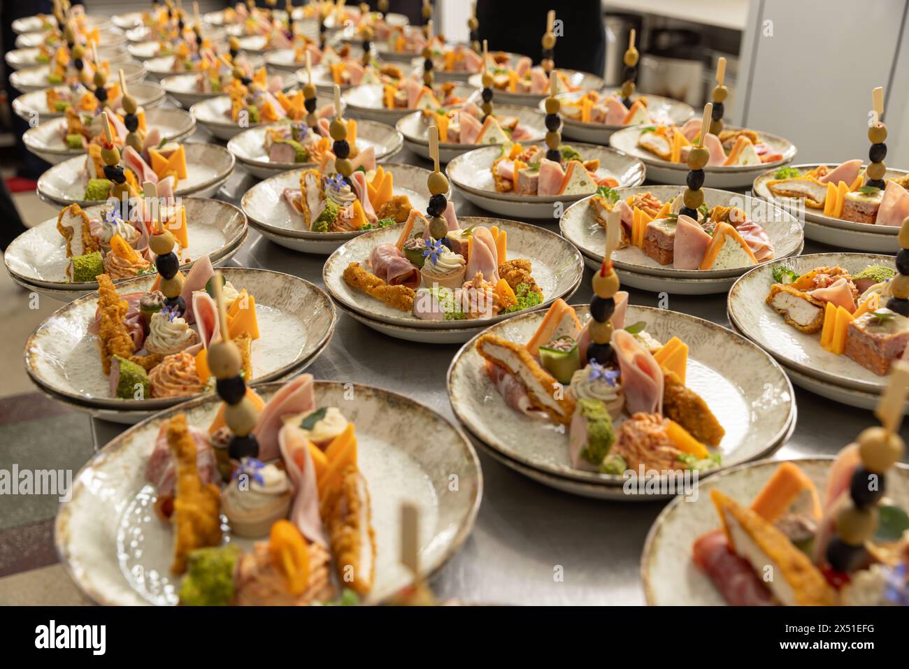 Elegant appetizer platters ready for serving on restaurant kitchen ...