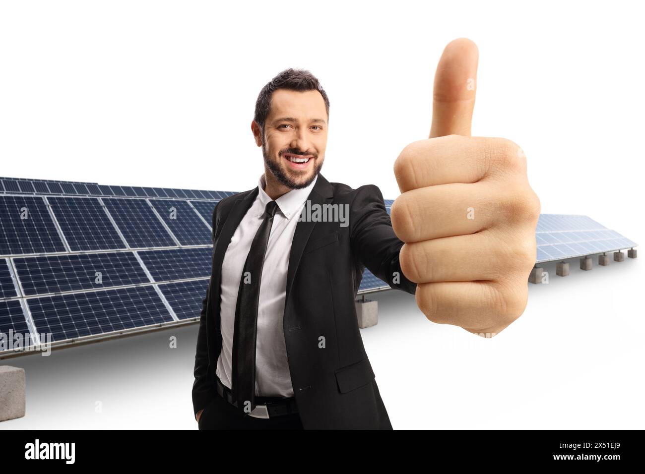 Happy businessman gesturing a thumb up sign in front of sustainable ...