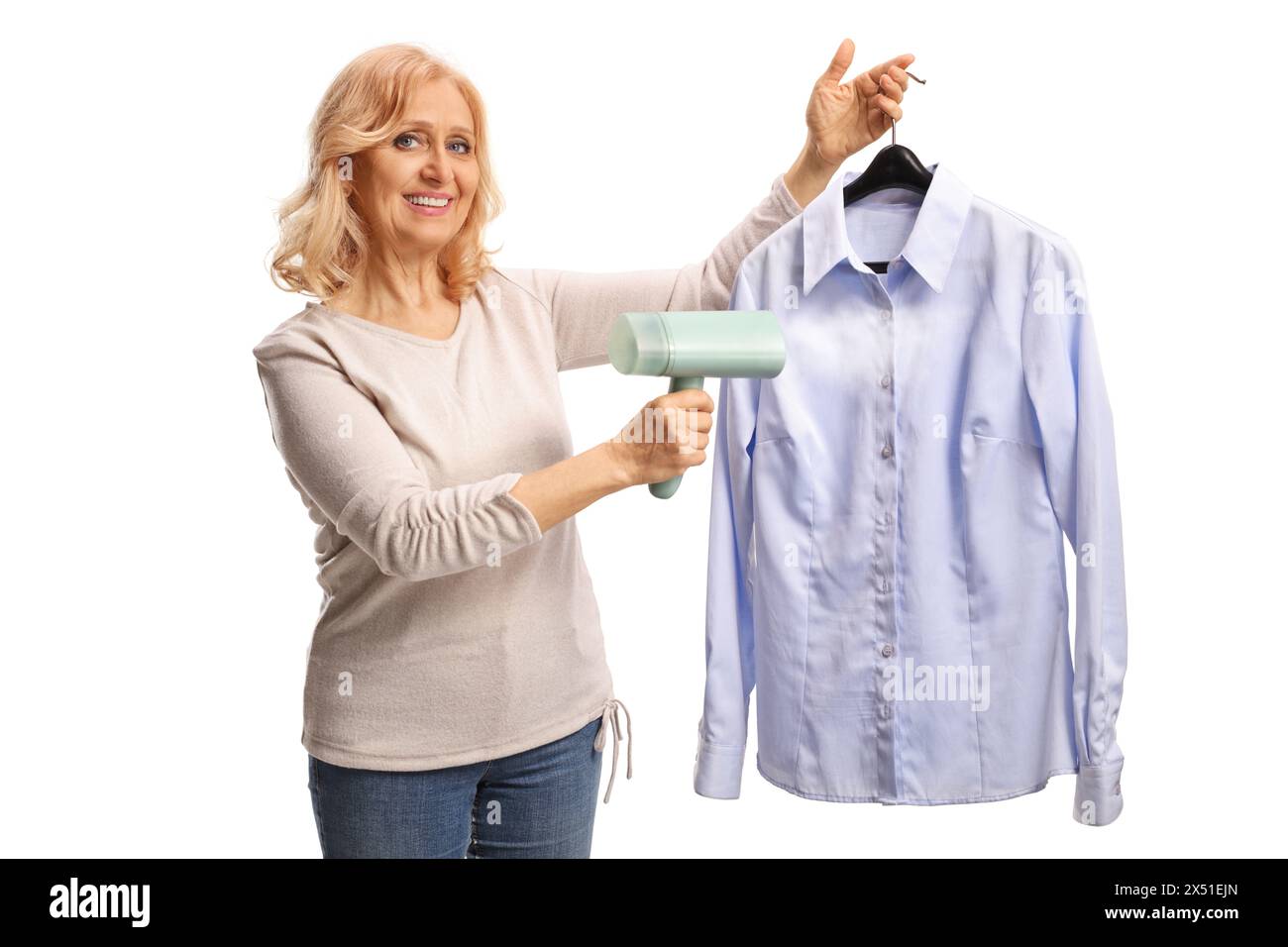 Using manual steamer ironing clothes hi-res stock photography and ...