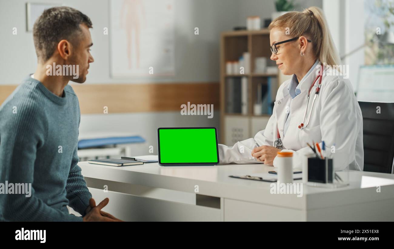 Female Physician Showing Tablet Computer with Green Screen Display to ...
