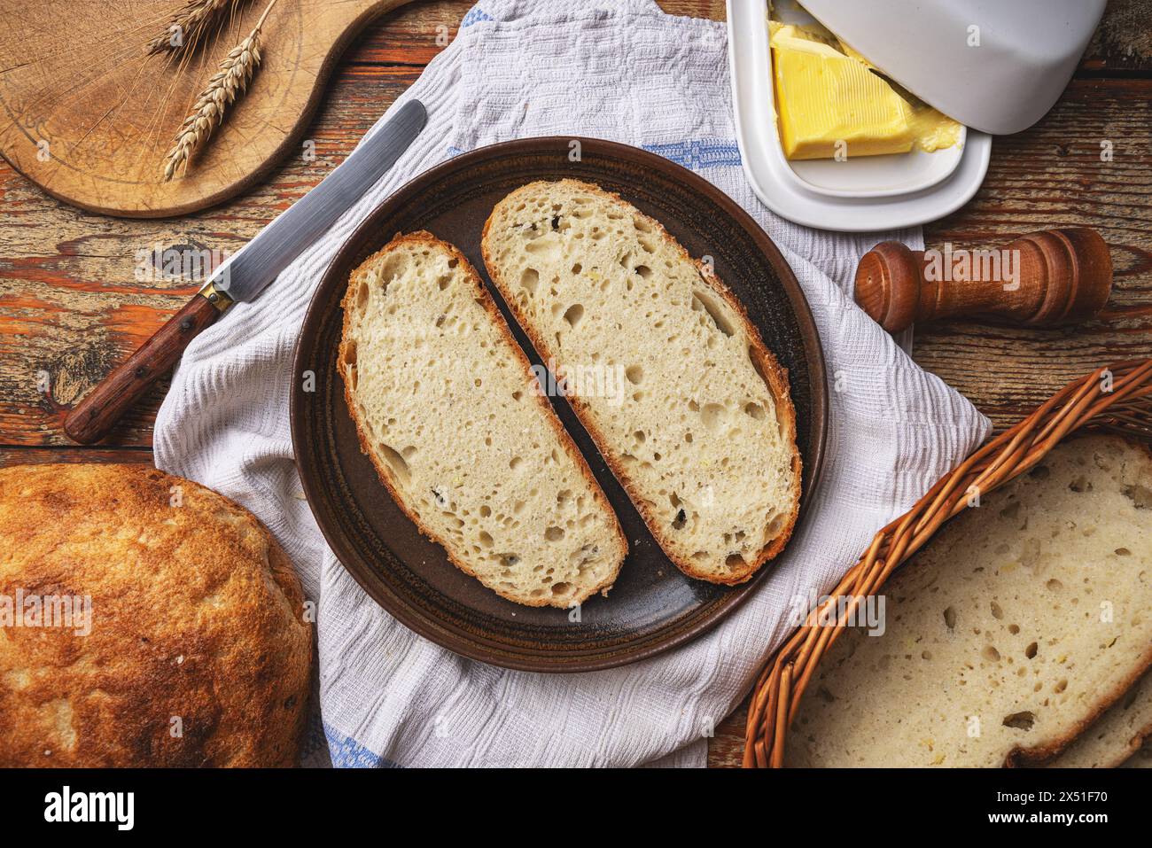 Rustic sourdough bread breakfast setup on rustic background Stock Photo ...