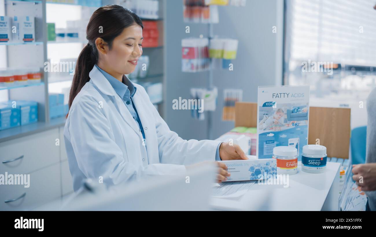 Pharmacy Drugstore Checkout Cashier Counter: Professional Asian Female ...