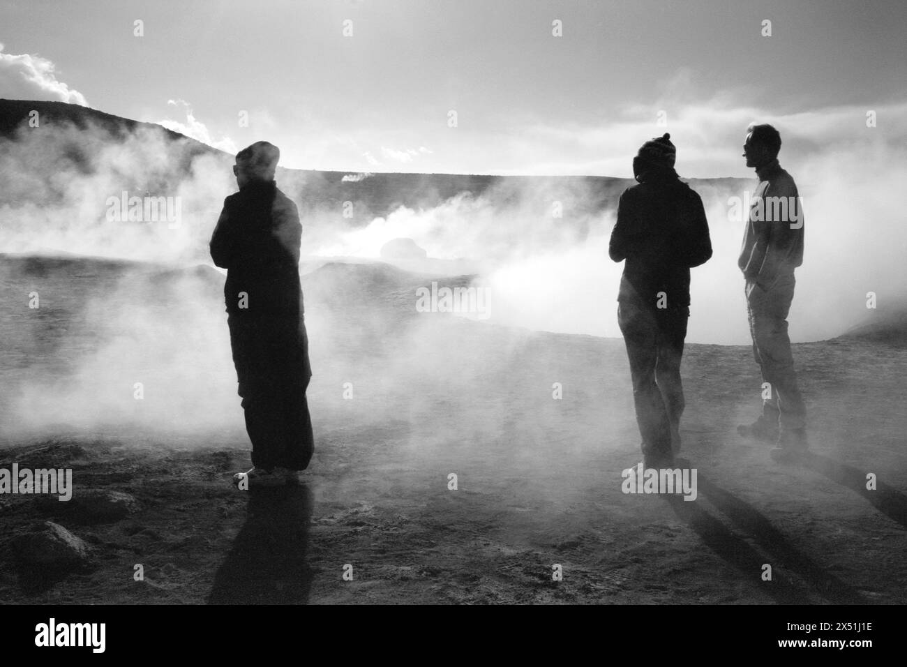 Tourists visit the mud pools of Bolivia's Salar de Uyuni Stock Photo ...