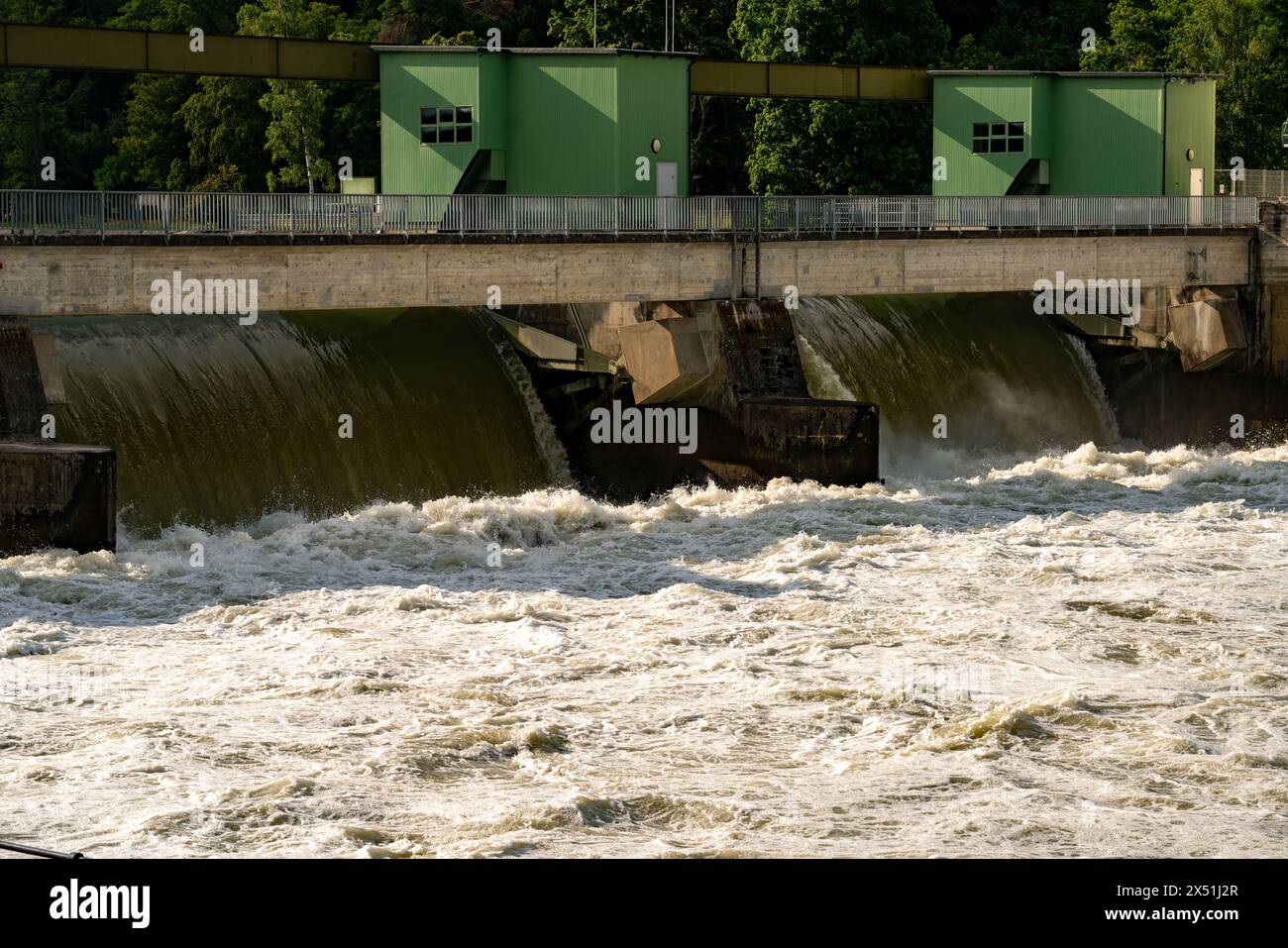 Hydroelectric power plant after heavy rain, with rapidly flowing water ...
