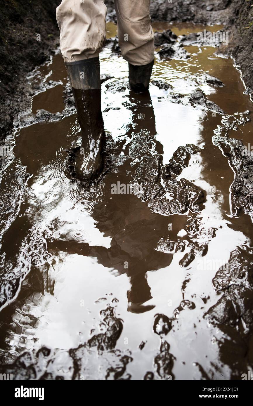 Hiking in the mud hi-res stock photography and images - Alamy