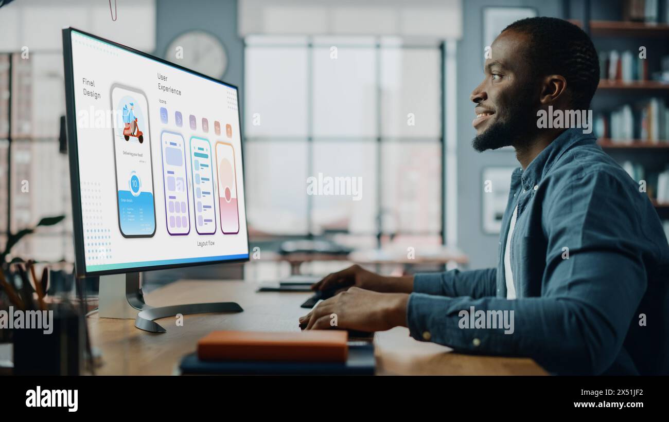 Handsome African American Designer Working On Desktop Computer In Creative Living Room