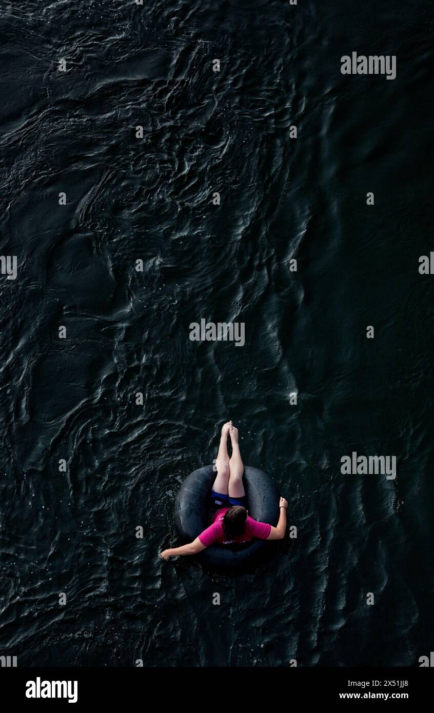 Floating down a river on a tube Stock Photo - Alamy