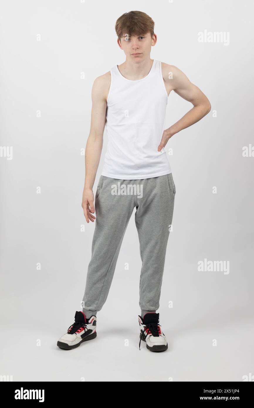 A Fifteen Year Old Teenage Boy Standing Against A White Background ...