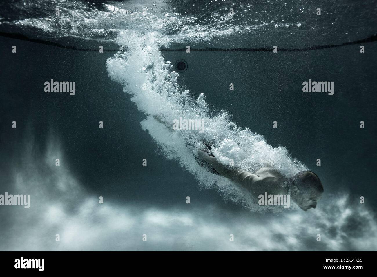 Underwater view of a man diving into a pool Stock Photo - Alamy