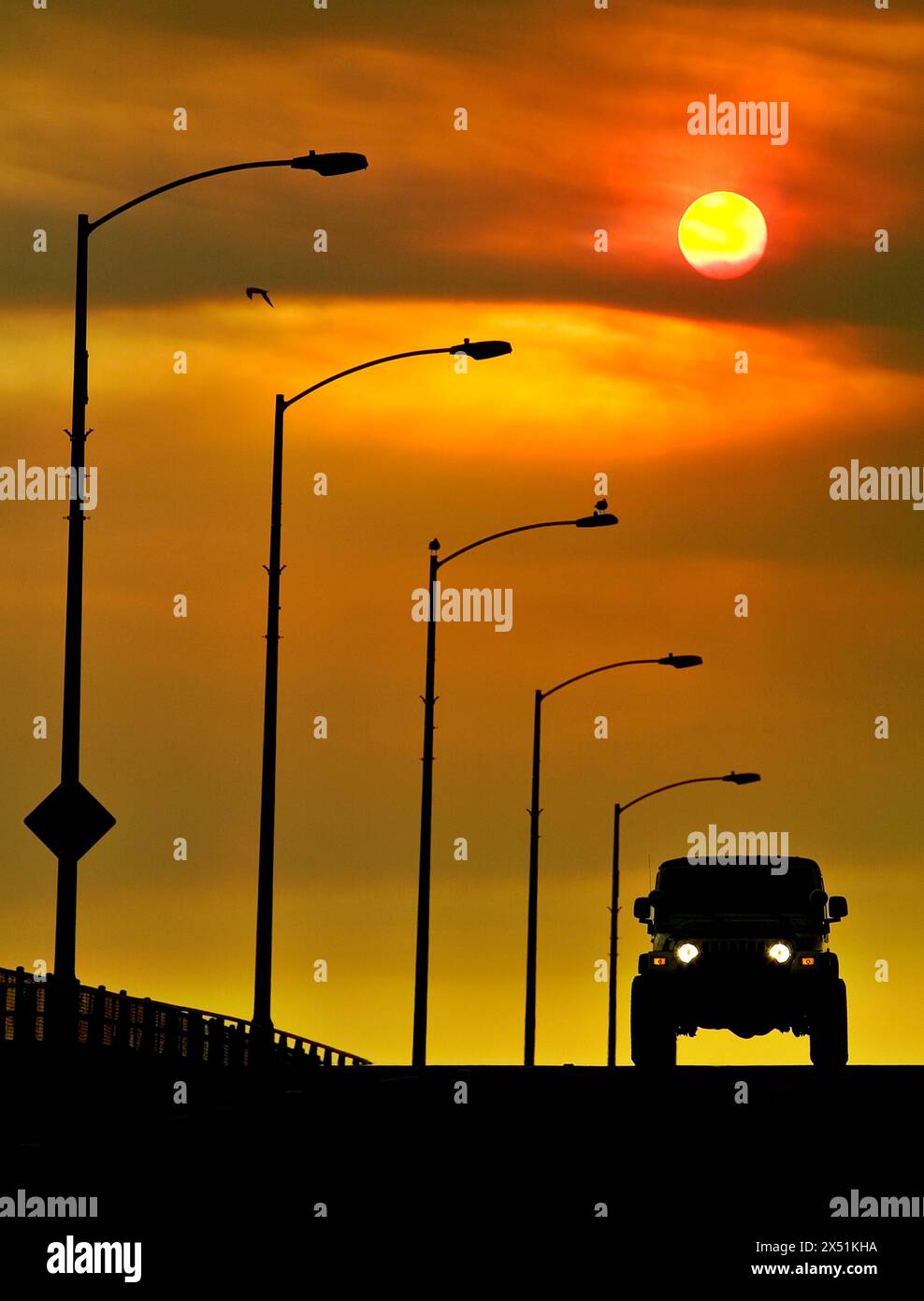 An SUV drives over a bridge in Oxnard, CA during sunset Stock Photo - Alamy