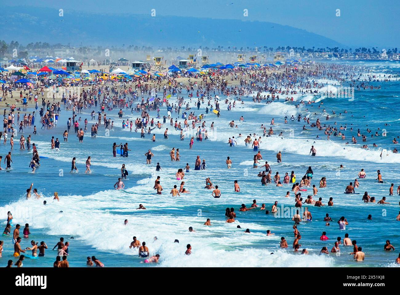 Thousands of people on the beaches in Huntington Beach, CA Stock Photo ...