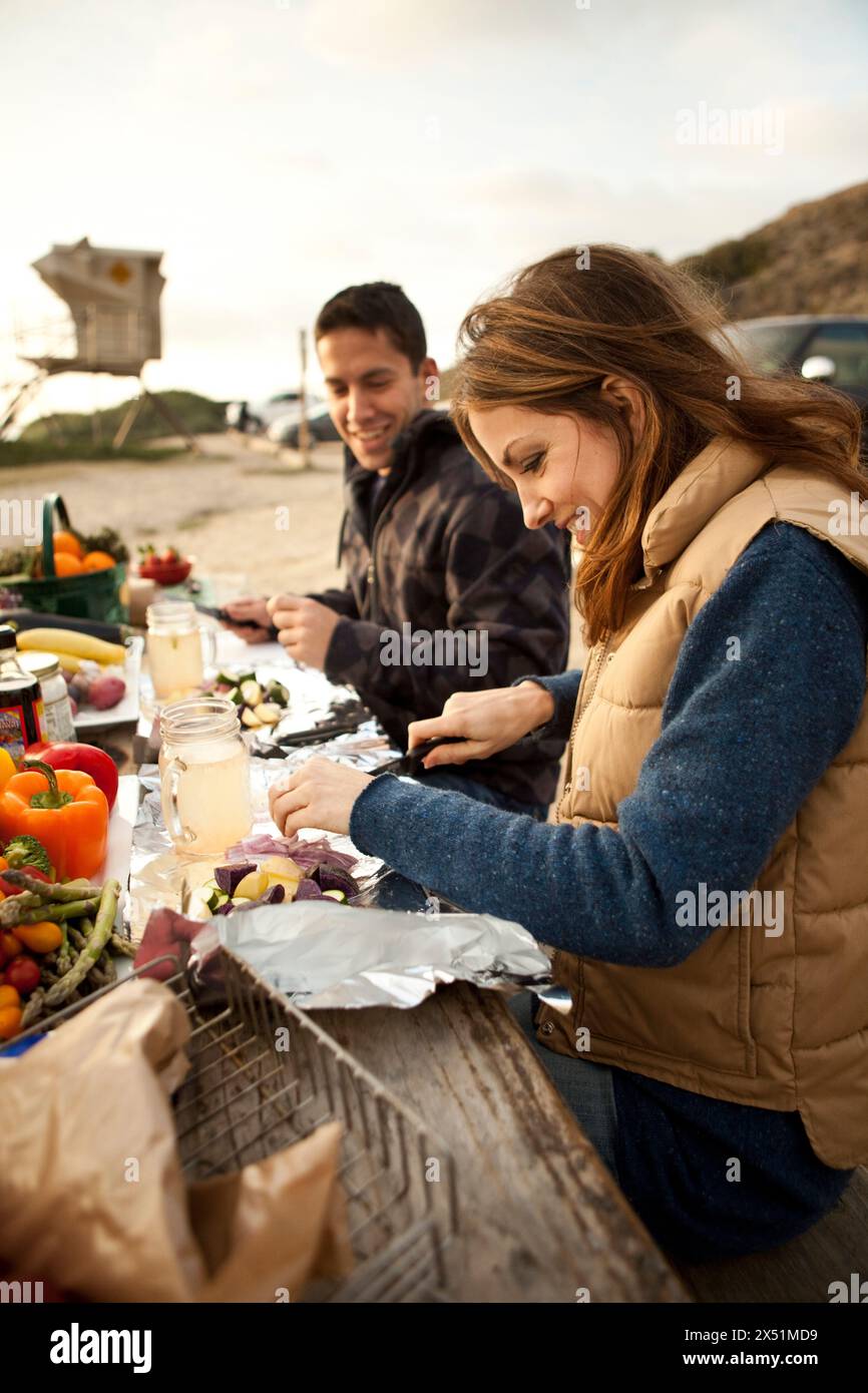 Food lifestyle on the beach. Making food around the fire Stock Photo ...