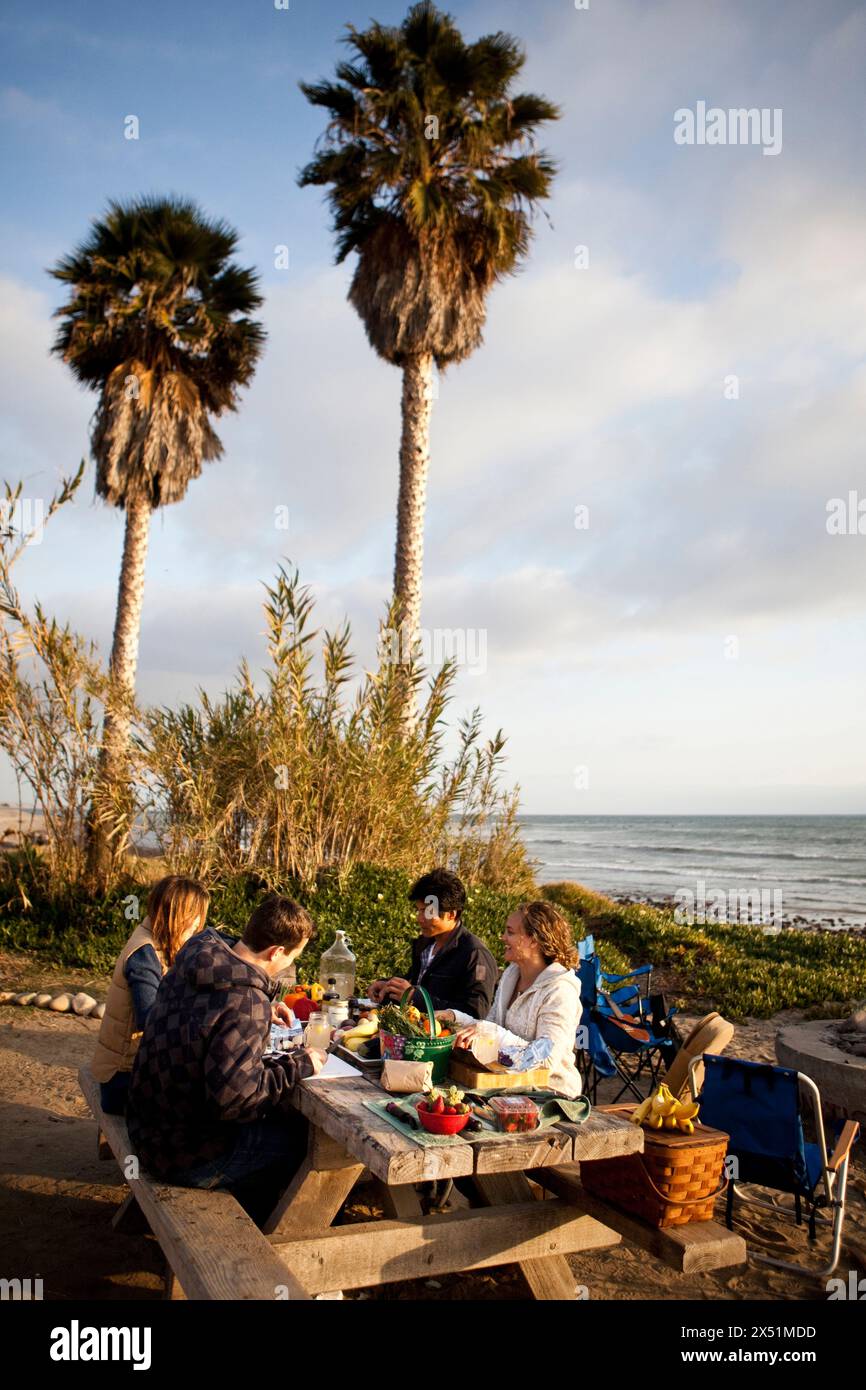 Food lifestyle on the beach. Making food around the fire Stock Photo ...