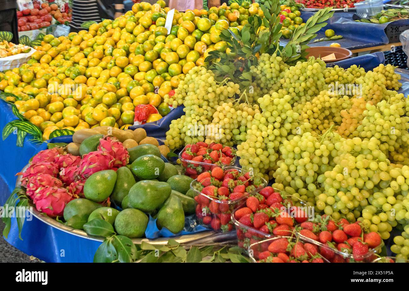 Fresh pile of raw organic fruits on market stall outdoors Stock Photo ...