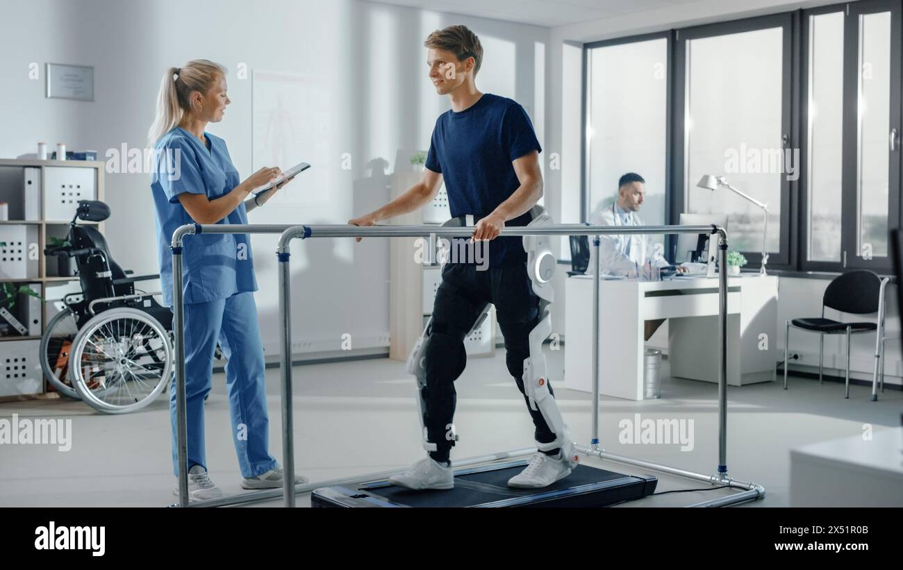 Modern Hospital Physical Therapy: Doctor Uses Tablet Computer, Helps ...