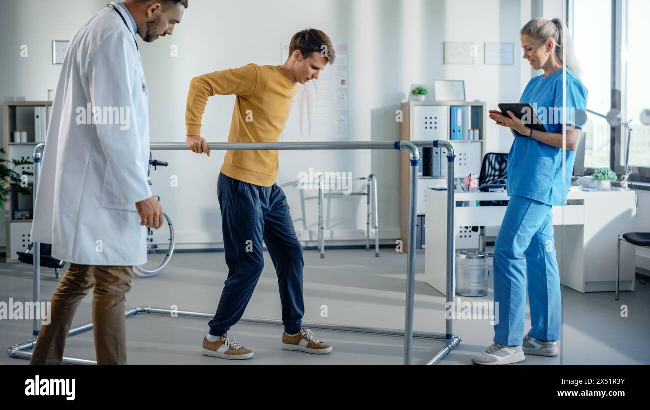 Hospital Physical Therapy Room: Patient with Injury Walking Holding for ...