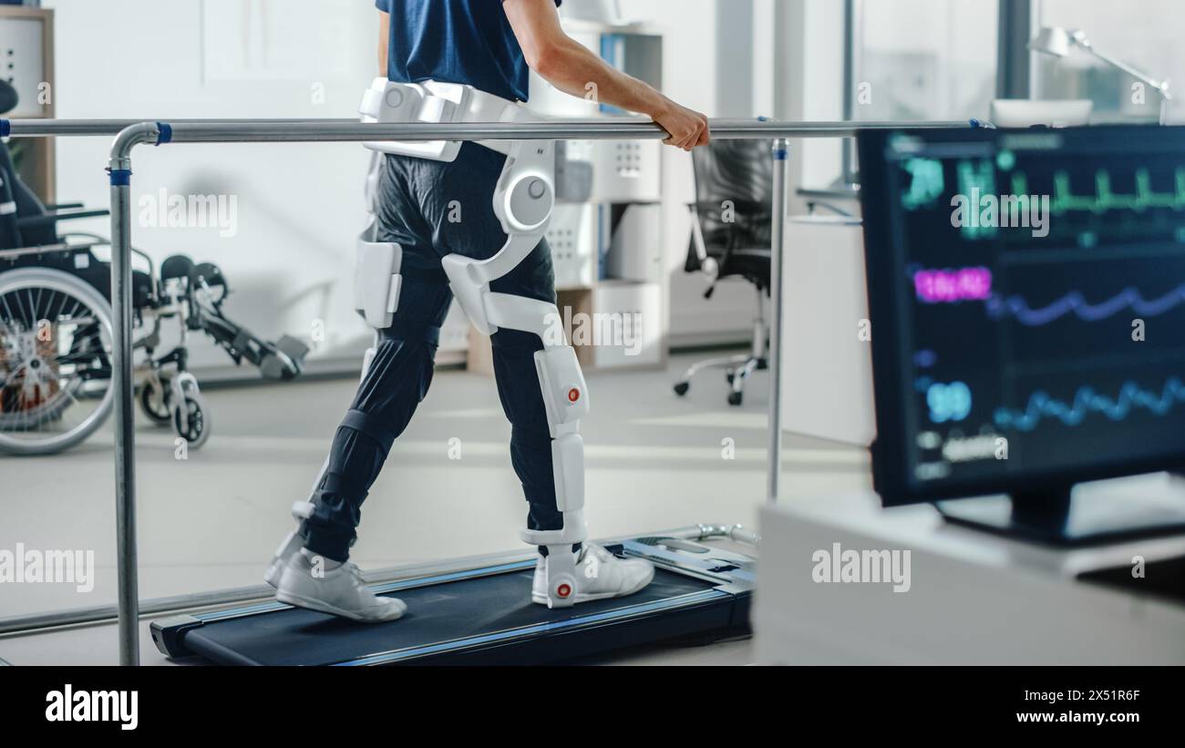 Modern Hospital Physical Therapy: Patient with Injury Walks on ...