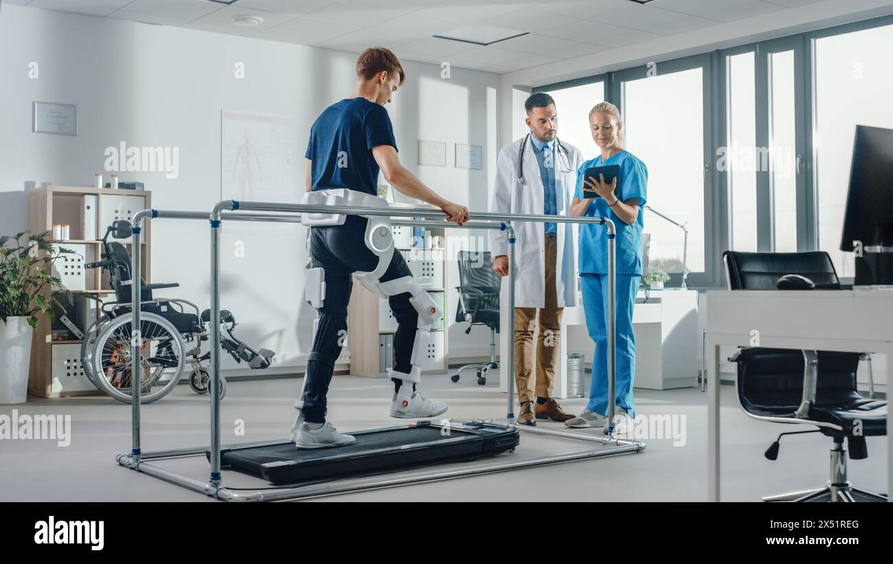 Modern Hospital Physical Therapy: Patient with Injury Walks on ...