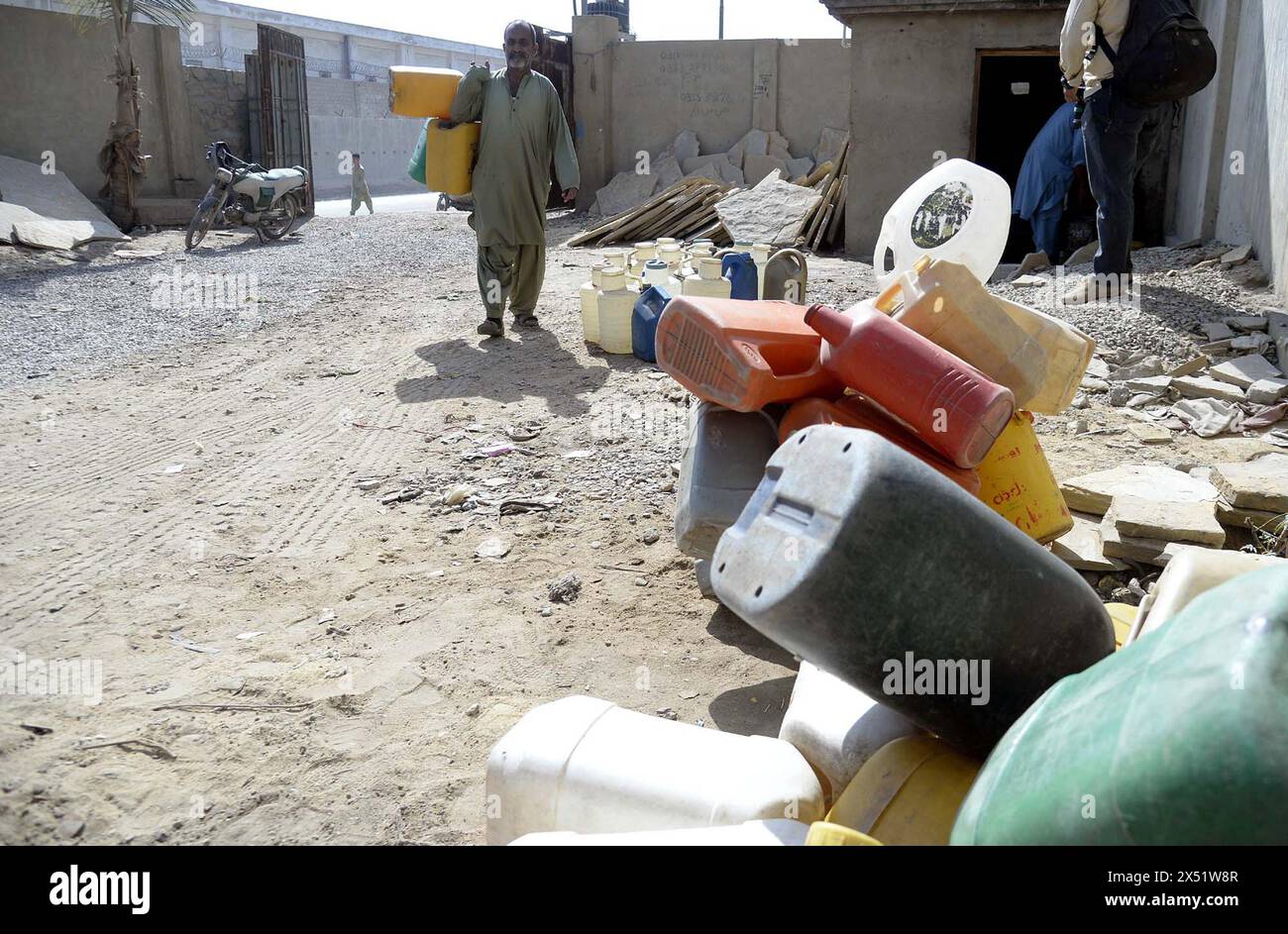 Citizen is carrying empty drinking water canes for searching drinking ...