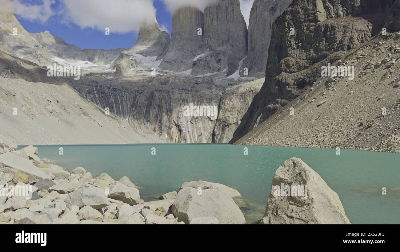 Majestic Torres del Paine Towers Over a Deep Turquoise Lake Stock Photo ...