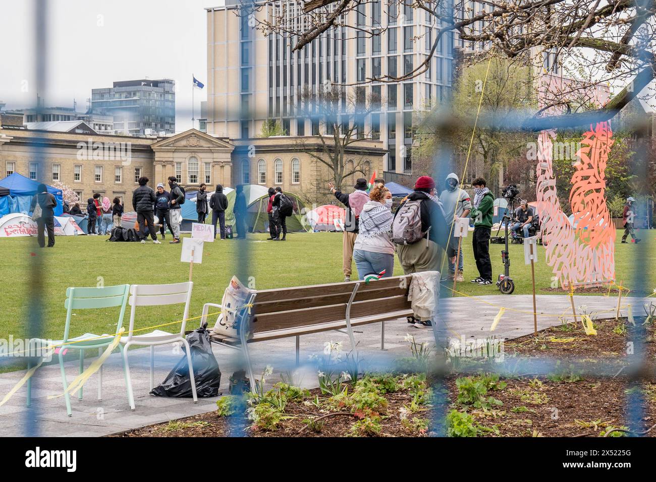 View through the gate of King College Circle where students are ...
