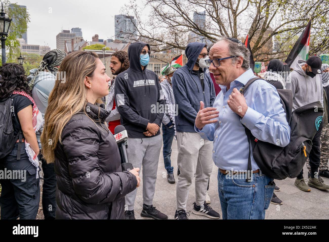 Jewish faculty member talks to media outside the encampment which ...