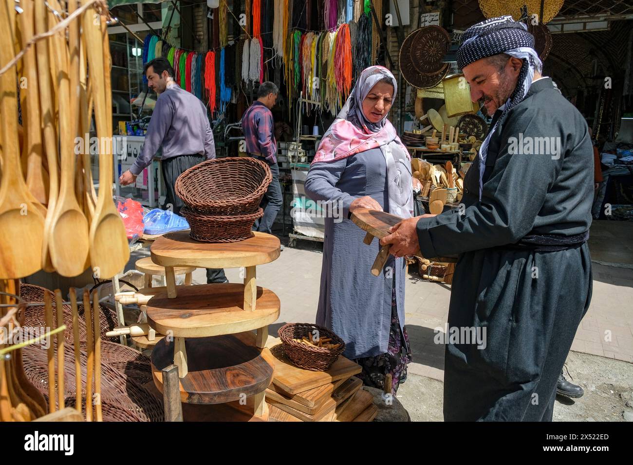 Sanandaj, Iran - April 13, 2024: A couple shopping for crafts at the ...