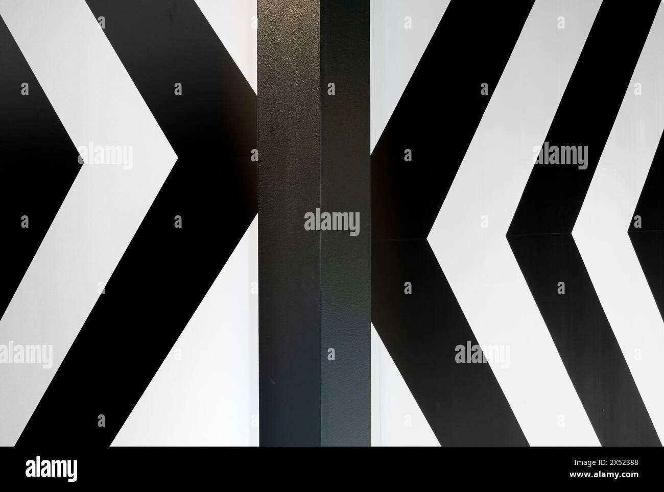 Abstract motif of black arrows from left and right on a white ...