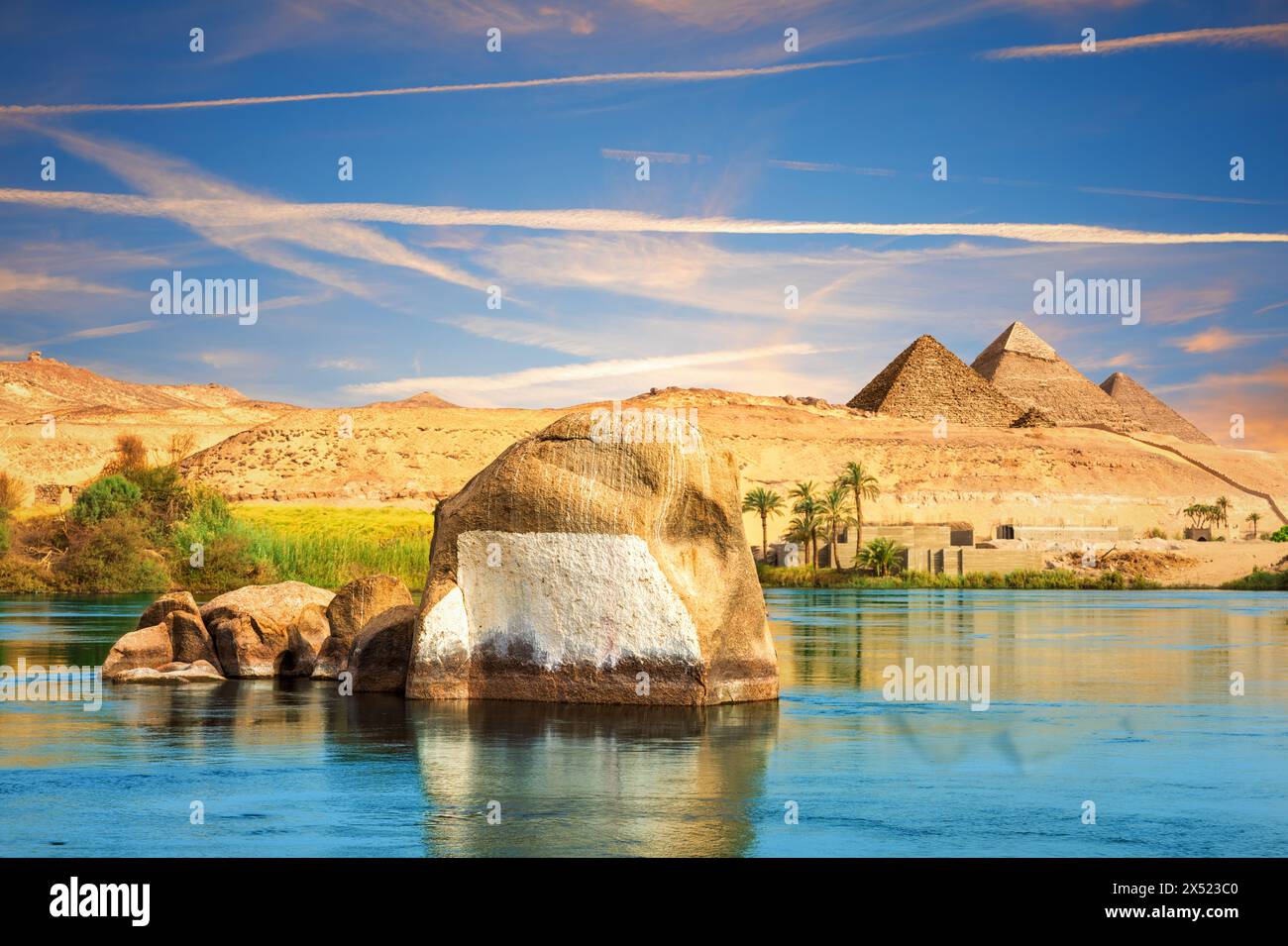 The Nile river and traditional ancient rocks on the way to pyramids ...