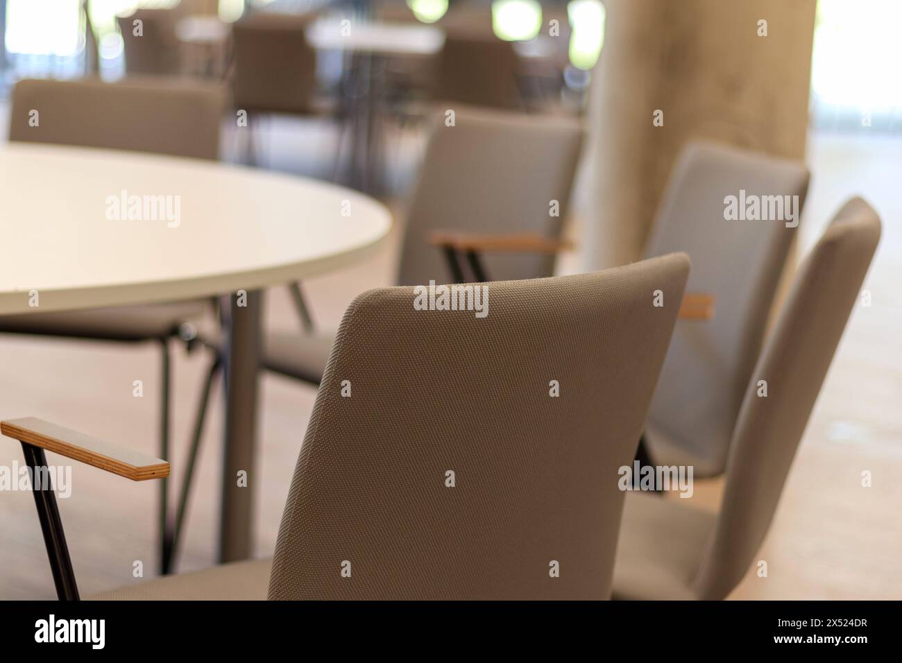 restaurant interior with round table and chairs Stock Photo - Alamy