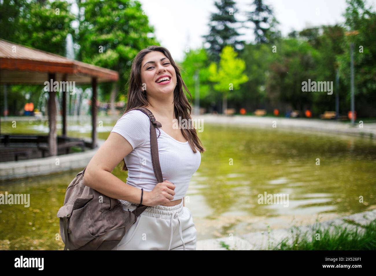 Happy smiling Turkish young woman portrait with student backpack Stock ...