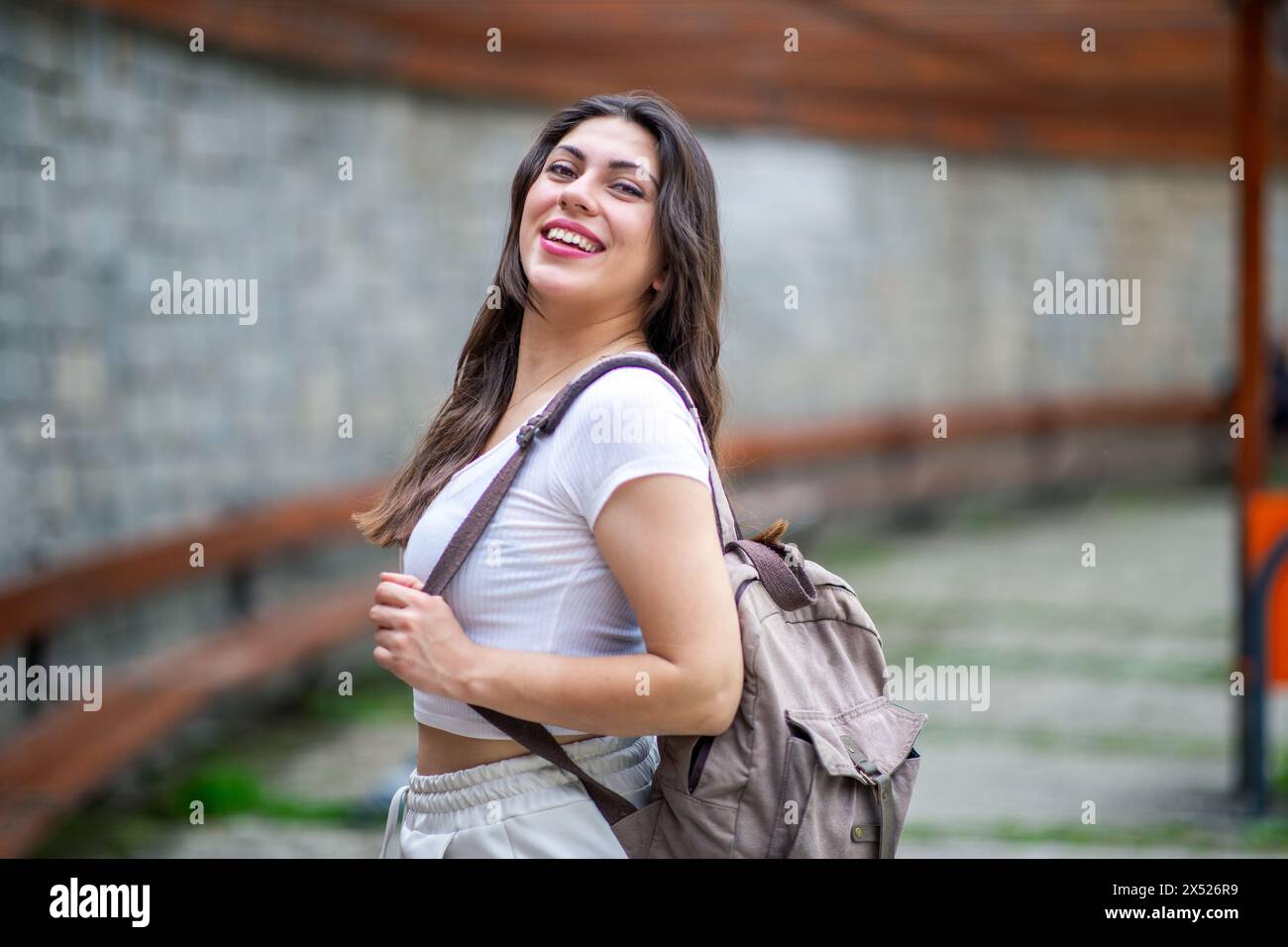 Happy smiling Turkish young woman portrait with student backpack Stock ...