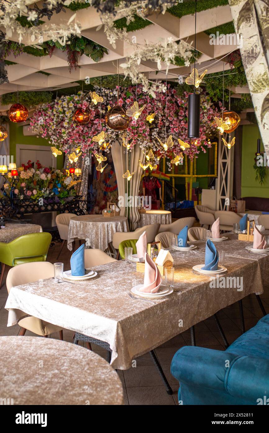 The image shows a beautifully decorated restaurant interior with a ...