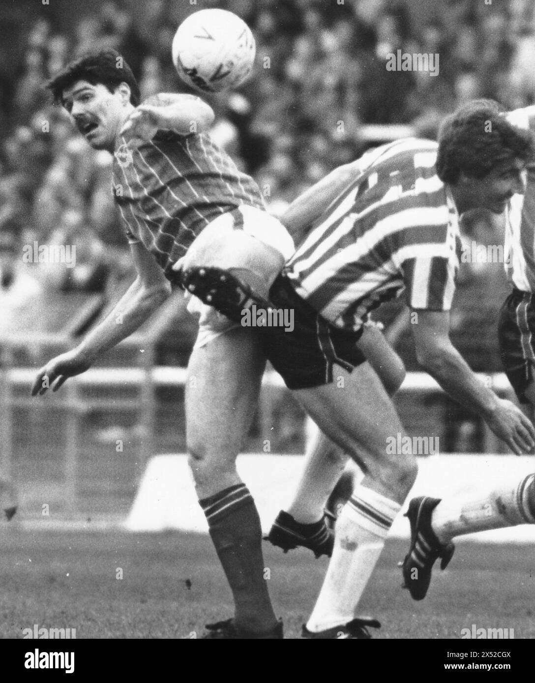 PORTSMOUTH'S MICK QUINN GOES CHEEK TO CHEEK WITH STOKE'S MARK HIGGINS ...