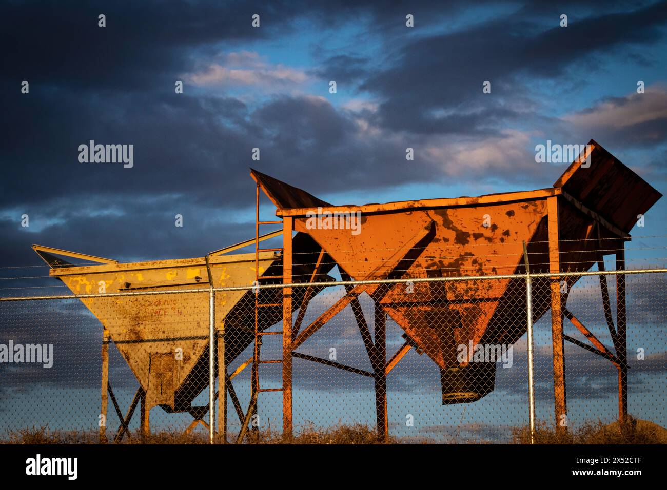 Old industrial aggregate hopper feeders Stock Photo - Alamy