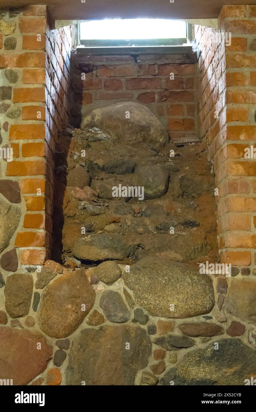 An enigmatic window in the underground chambers of an ancient castle ...