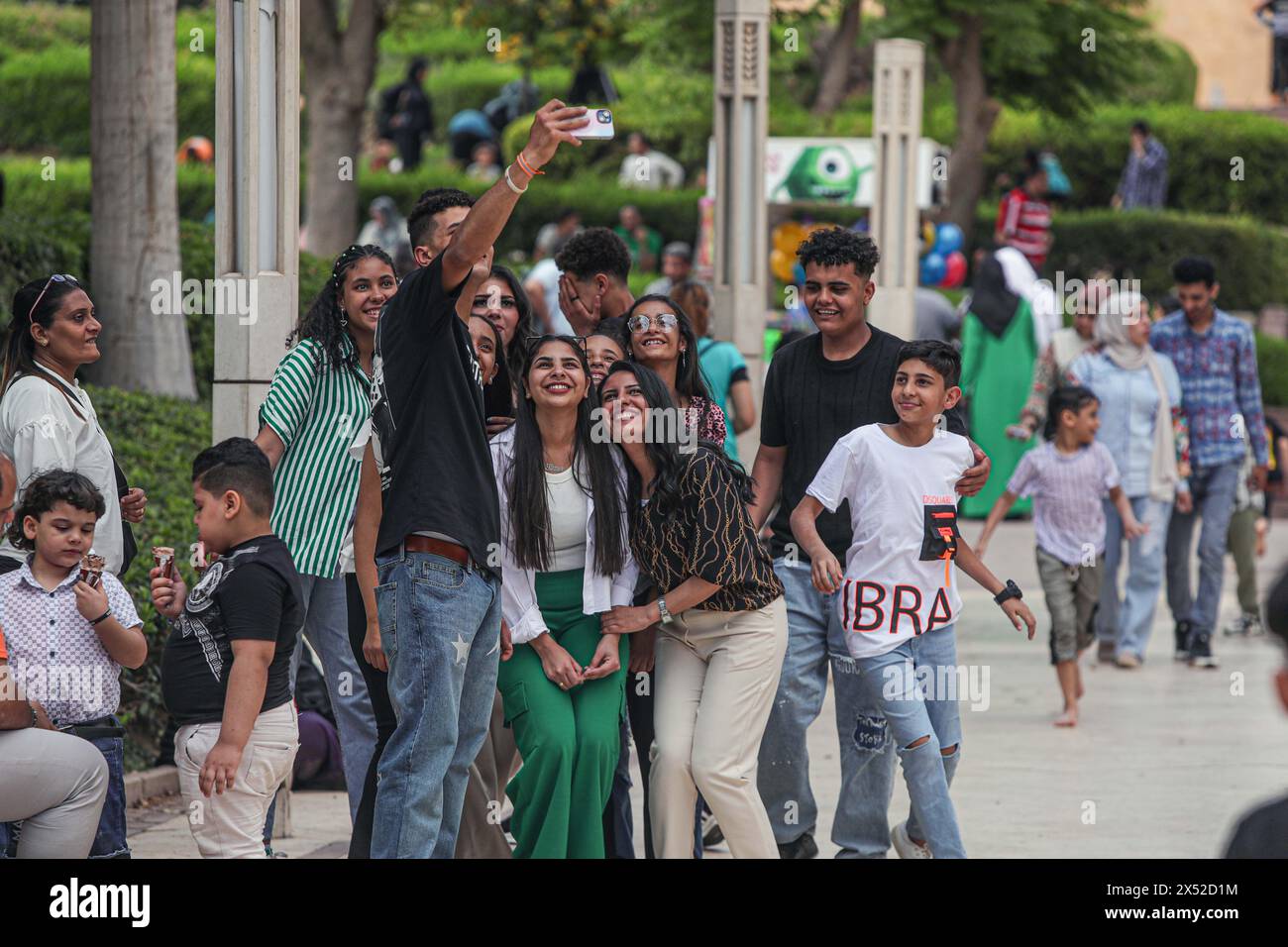 Cairo, Egypt. 6th May, 2024. People pose for a selfie during the Sham ...