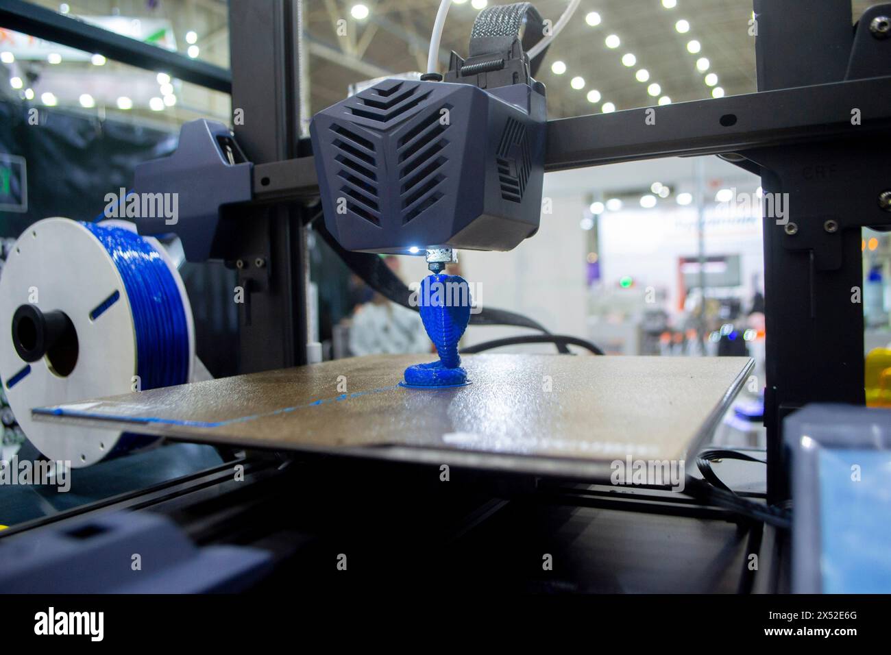 3D printer working close-up. 3D printer prints a model from molten ...