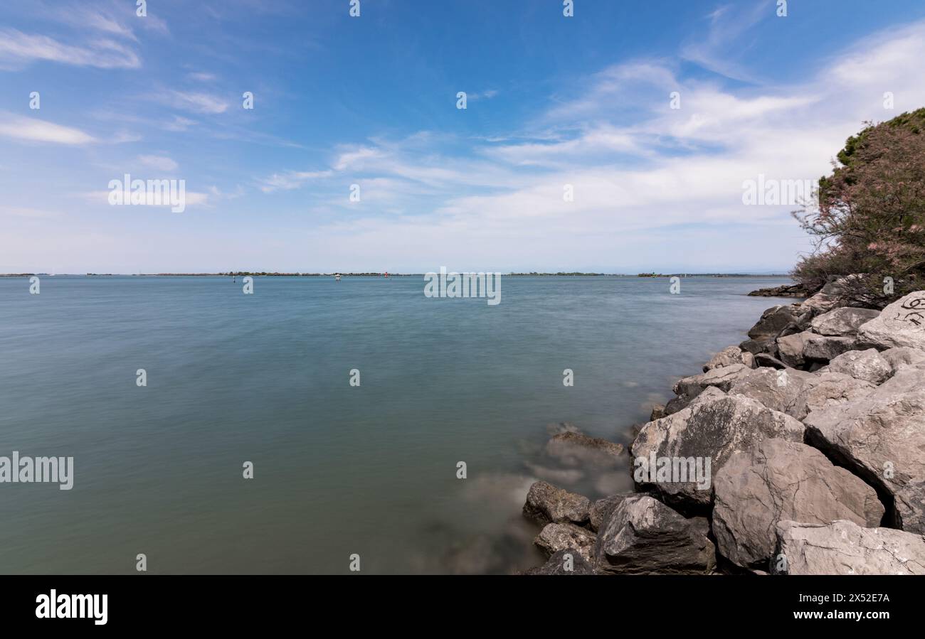 Panorama of the sky and sea in Grado, Italy with long exposure sunny ...